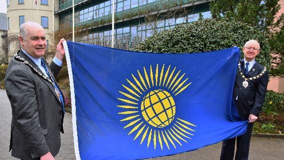 Chairman hoists the Commonwealth flag | tenby-today.co.uk