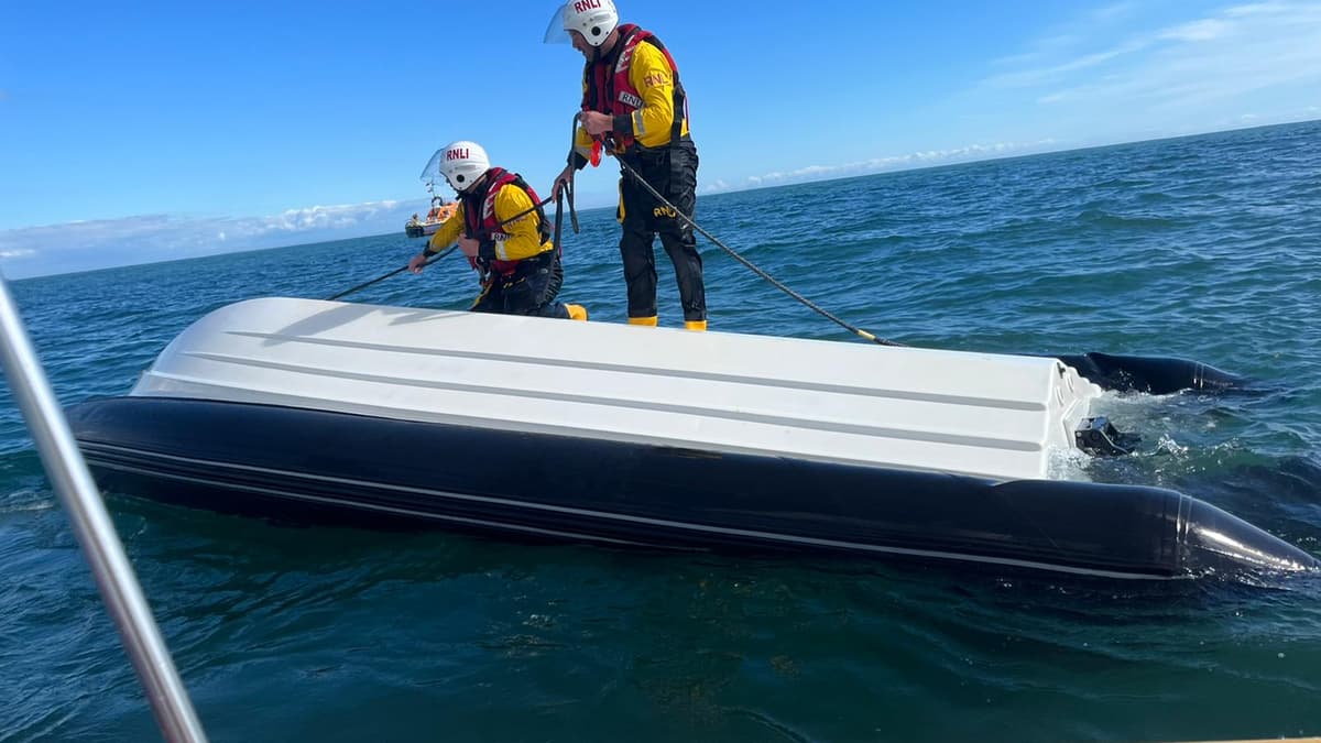 Tenby lifeboat crew tend to two people and their dog stranded after ...