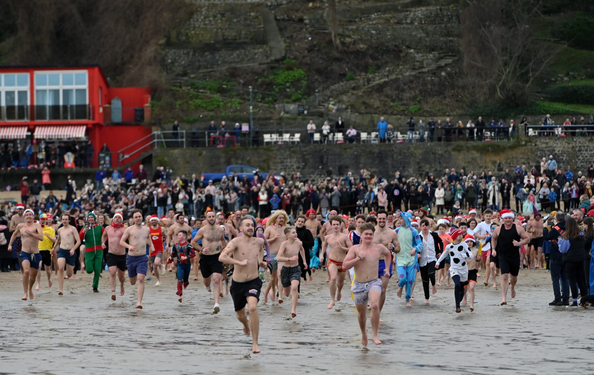 Watch as 100s take to the sea for Tenby's Boxing Day Charity Swim ...