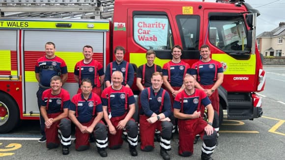 Local community gathers for successful car wash event at fire station ...